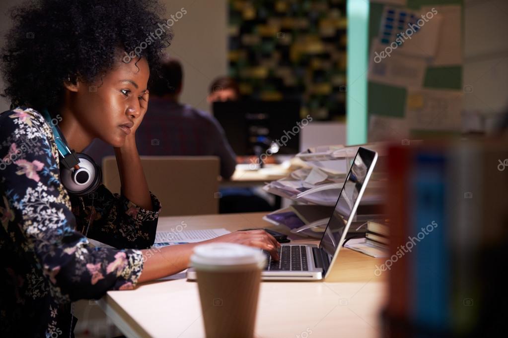 Office Worker With Coffee Working Late Stock Photo by ©monkeybusiness ...