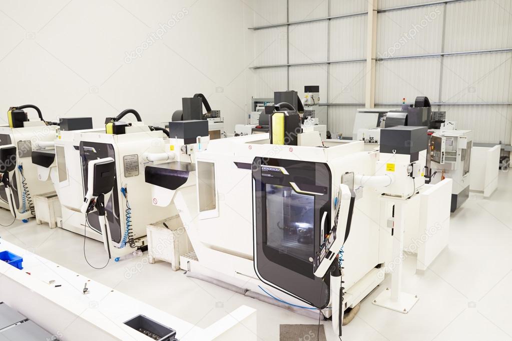 Engineering Workshop With CNC Machines Stock Photo by ©monkeybusiness ...