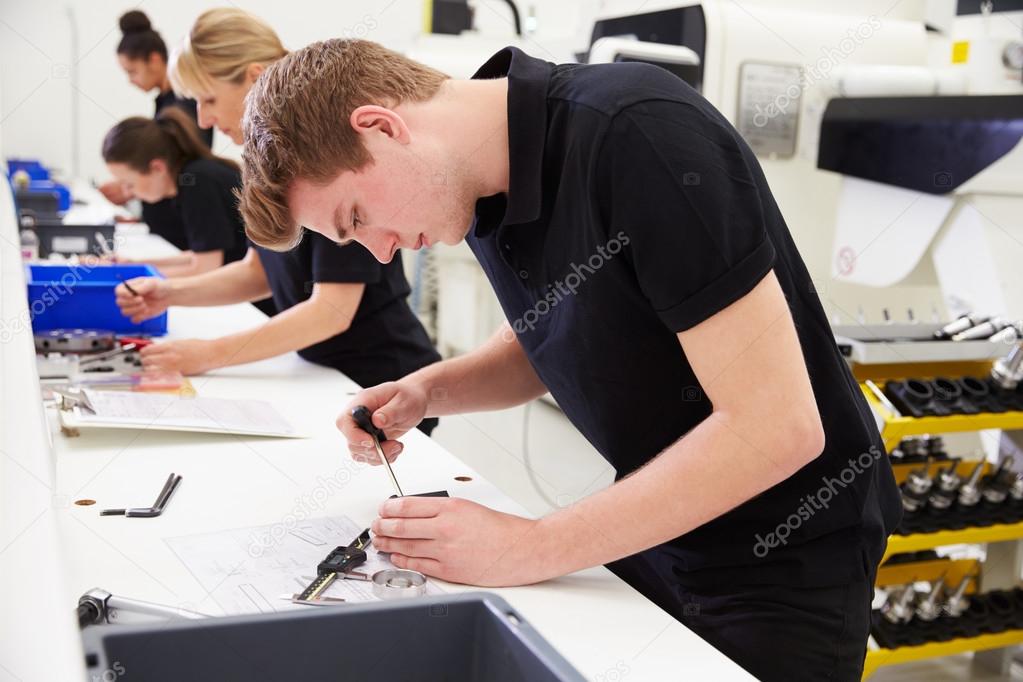 Workers Checking Component Quality Stock Photo by ©monkeybusiness 106187294