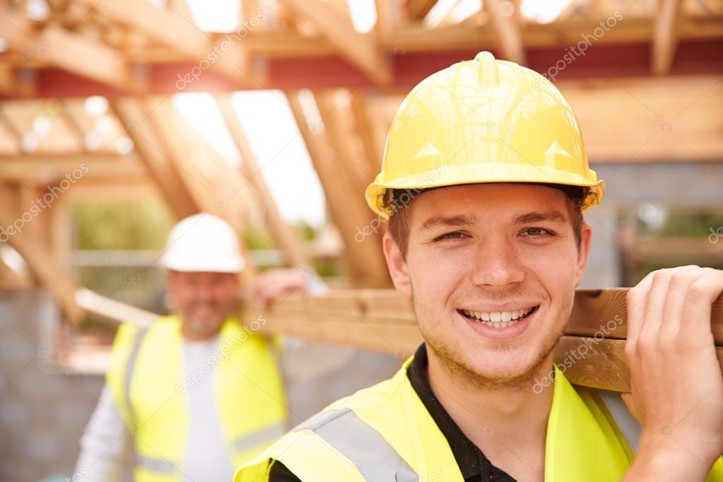 Builder And Apprentice On Construction Site — Stock Photo ...