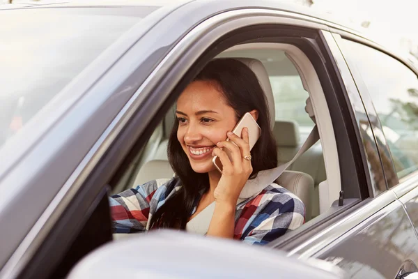 Female driver using phone in a car - Stock Image - Everypixel