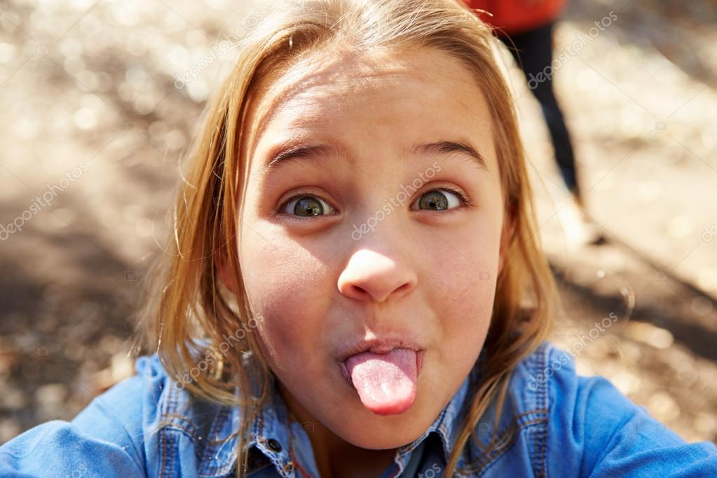 Girl Pulling Face For Selfie Photograph Stock Photo by ©monkeybusiness ...