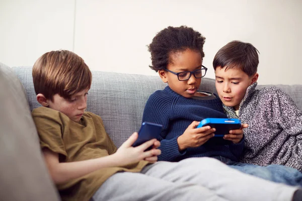 Overhead Shot Two Boys Gaming Together Hand Held Devices Home Stock ...
