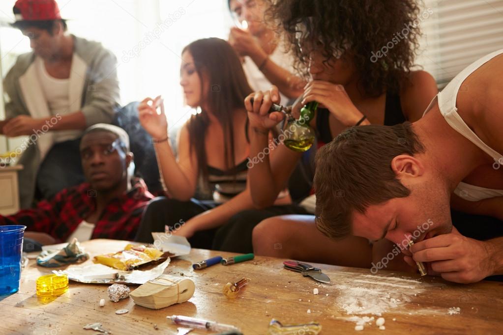 Gang Of Young People Taking Drugs — Stock Photo © monkeybusiness #59344895 Gang Of Young People Taking Drugs — Stock Photo © monkeybusiness #59344895