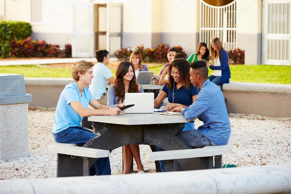 Students Hanging Out On Campus — Stock Photo © monkeybusiness #59346645