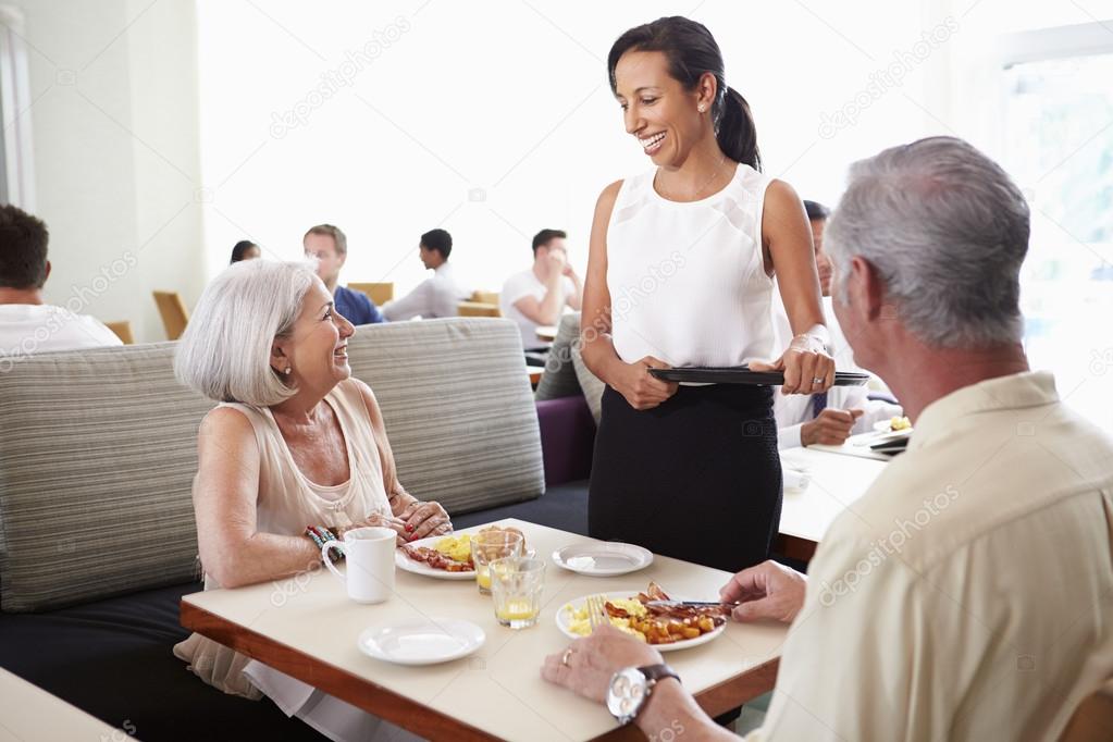 Waitress Serving Breakfast