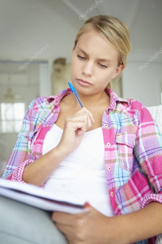 Girl writing in notebook Stock Photo by ©monkeybusiness 61029873