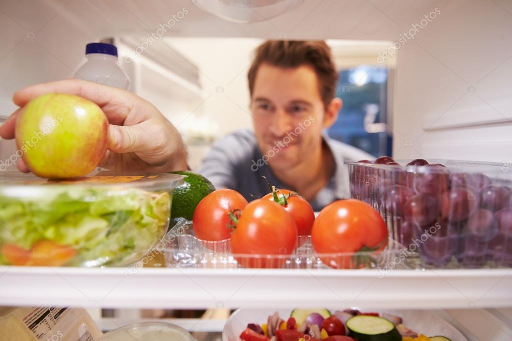 Man Looking Inside Fridge — Stock Photo © monkeybusiness #68249753