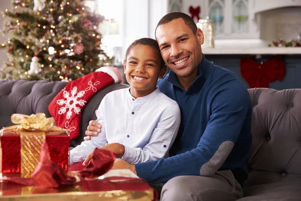 Father And Son Opening Christmas Presents - Stock Image - Everypixel