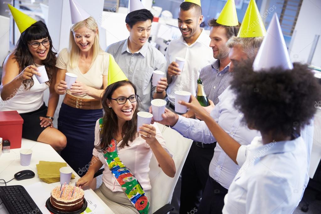 Celebrating a colleague's birthday in the office Stock Photo by ...