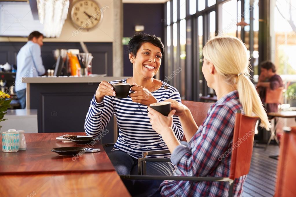 Friends talking at a coffee shop — Stock Photo © monkeybusiness #98214140