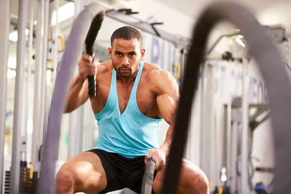 Man working out at a gym - Stock Image - Everypixel