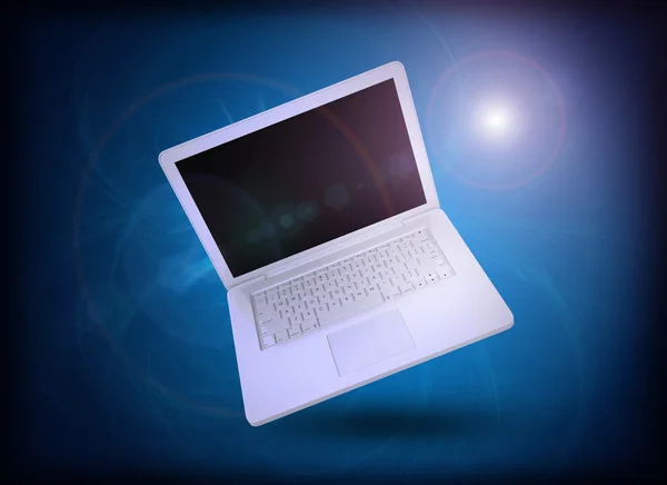 Laptop at angle on abstract blue background - Stock Image - Everypixel