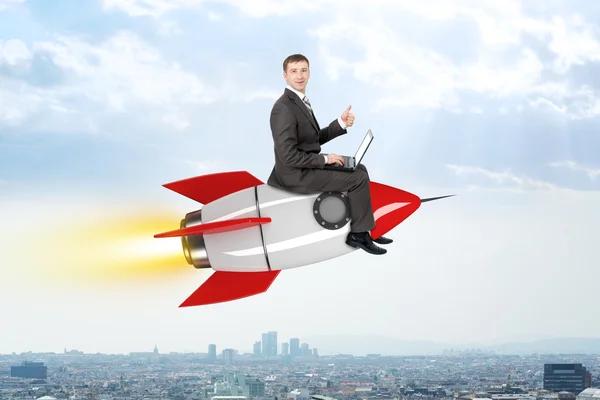 Businessman flying on rocket - Stock Image - Everypixel