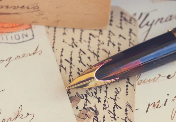 Writing a letter with a retro fountain pen Stock Photo by ...