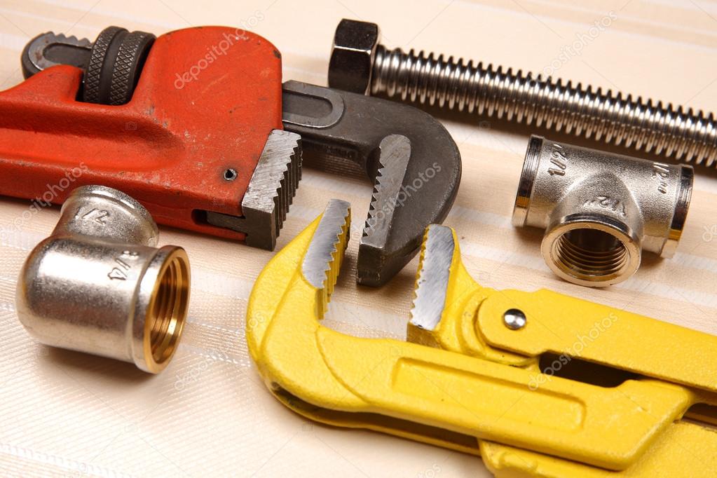Fitting and two adjustable wrenches for plumbing works — Stock Photo ...