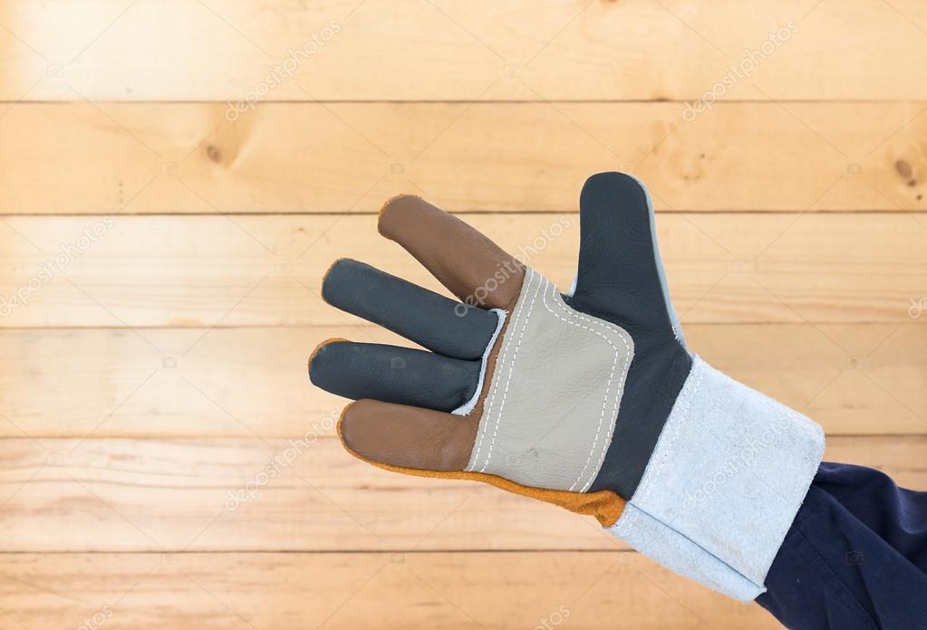 Hand in rough leather glove Stock Photo by ©stoonn 122502682