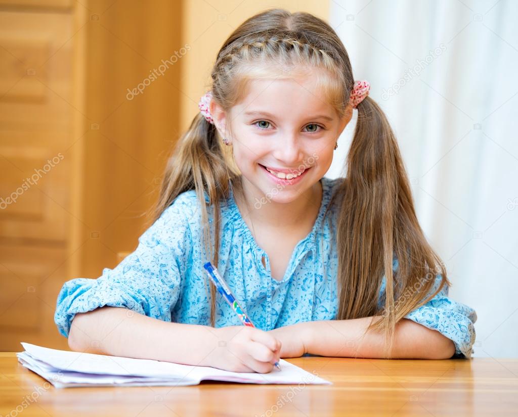 Cute little girl studying Stock Photo by ©GekaSkr 57683809