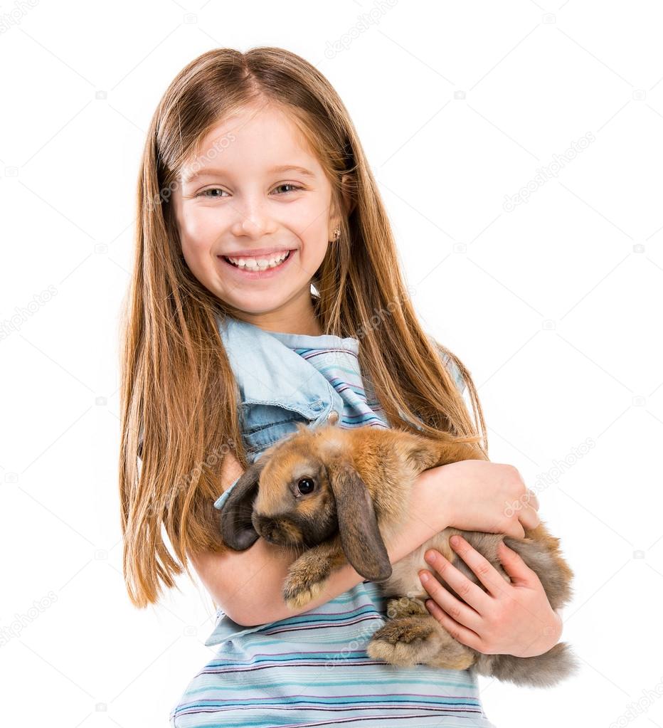 Little girl with rabbit Stock Photo by ©GekaSkr 58008283