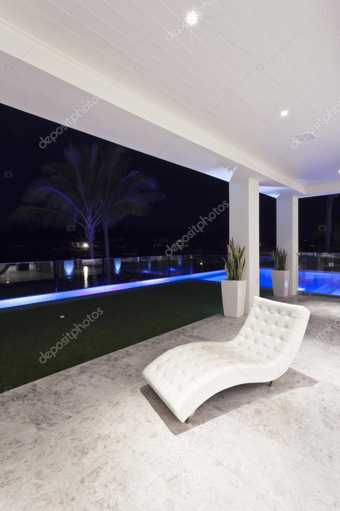 White beach chair in front of a pool Stock Photo by ©jrstock1 79269136