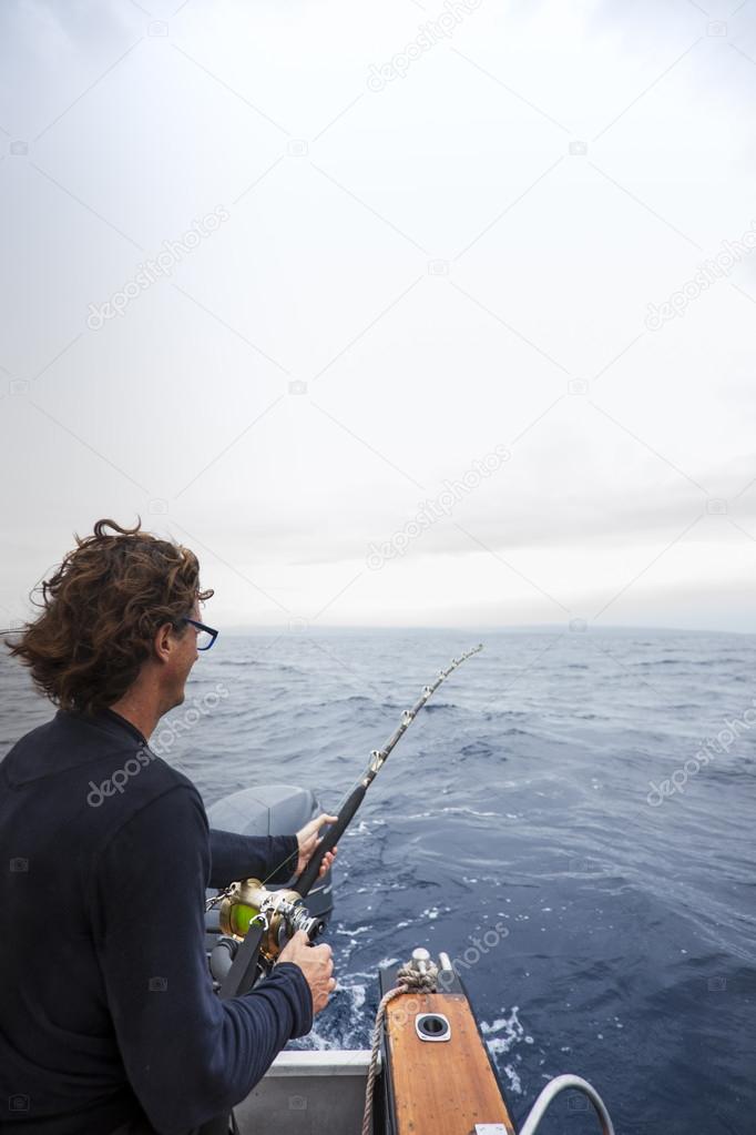 Man catching a marlin — Stock Photo © jrstock1 #89948152