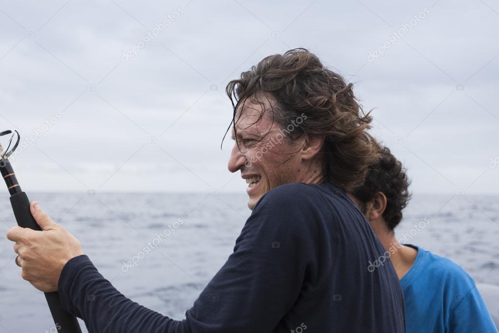 A man catching a big fish — Stock Photo © jrstock1 #89948328