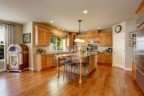 Classic American kitchen inerior with brown cabinets and granite ...