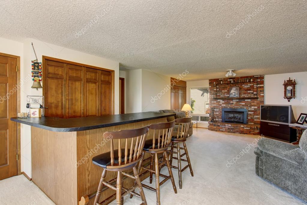 Open floor plan in luxury home. Living room with brick fireplace and ...