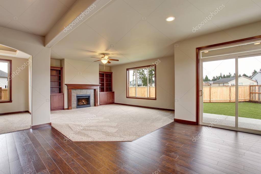 Open floor plan interior with carpet and fireplace — Stock Photo ...