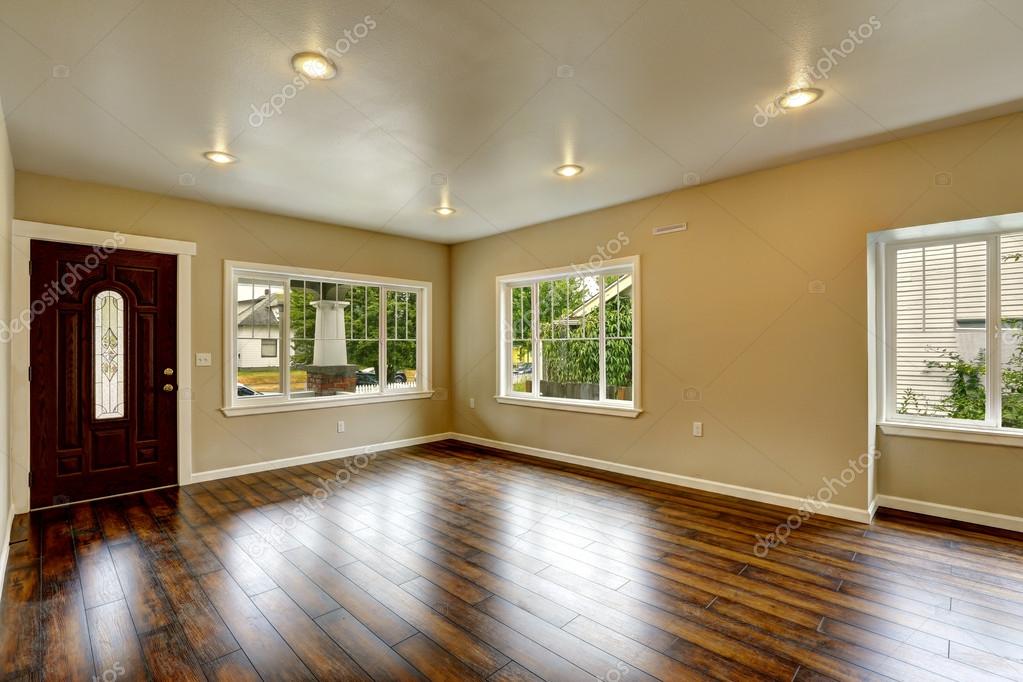 Empty house interior. Spacious living room with new hardwood flo ...