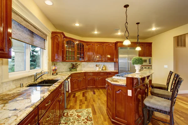 Large luxury kitchen with marble counters. - Stock Image - Everypixel