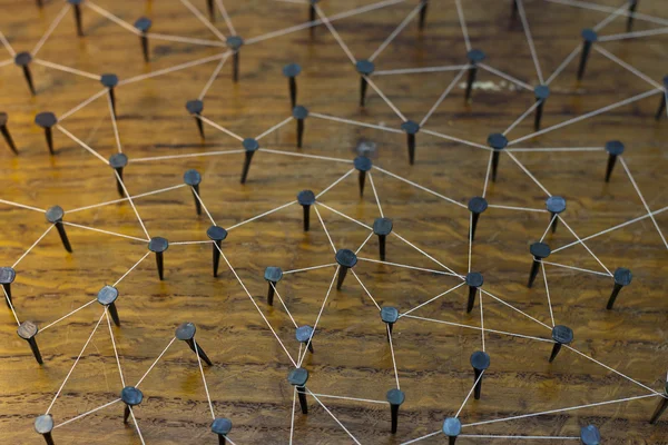 Rustic nails in wood linked by cotton - Stock Image - Everypixel