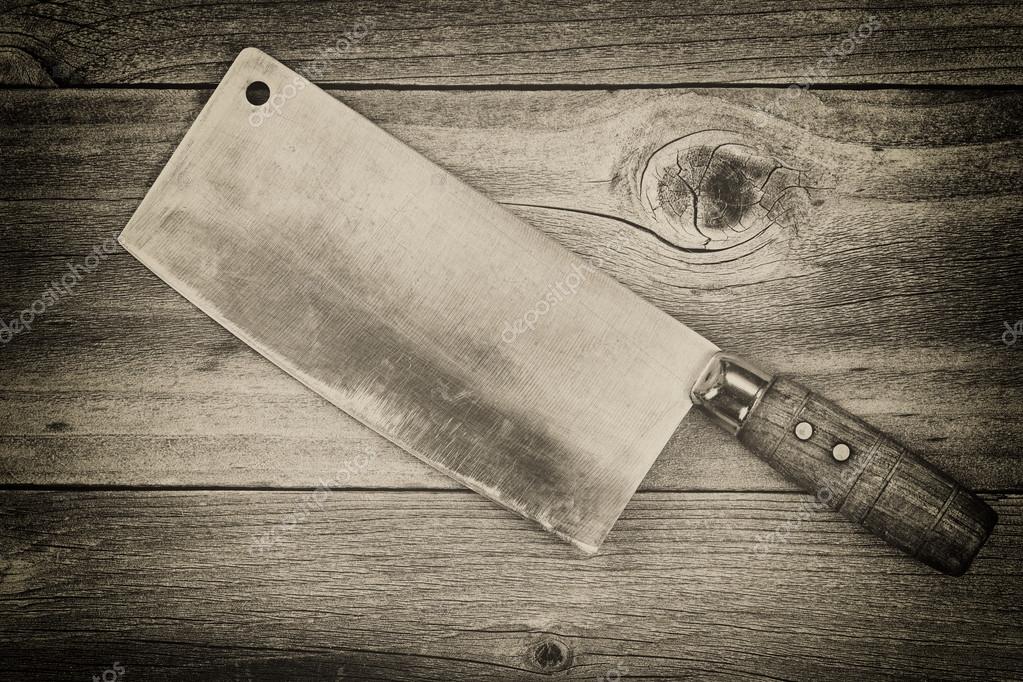 Vintage butcher Knife on rustic cedar wood — Stock Photo © tab62 #69779389