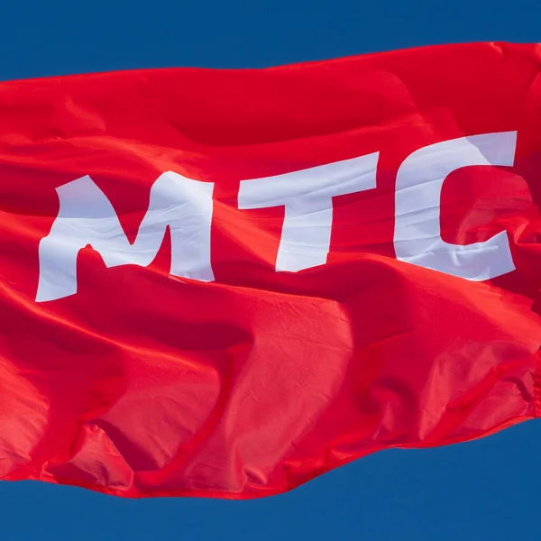 Flag with emblem, symbols of Mobile TeleSystems (MTS) - mobile operator ...