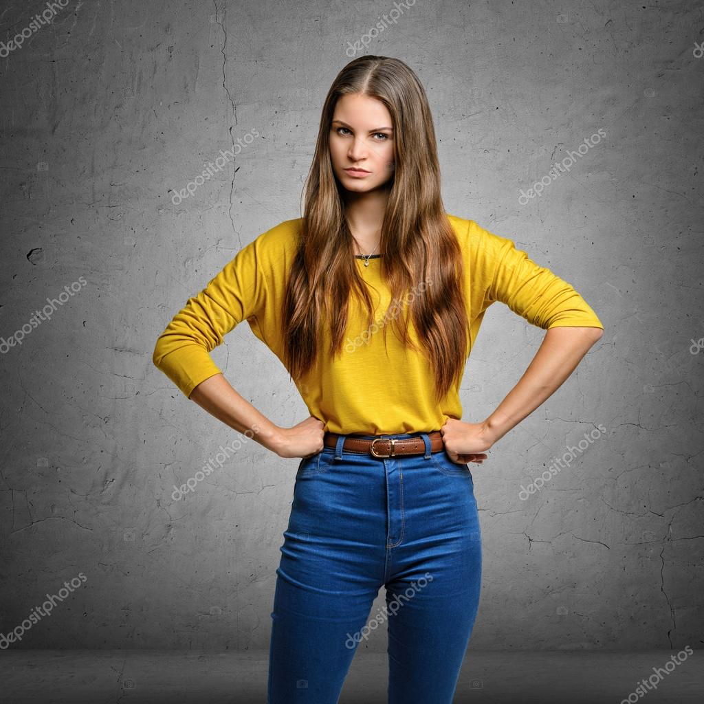 Woman put her hands on belt with serious expression — Stock Photo ...