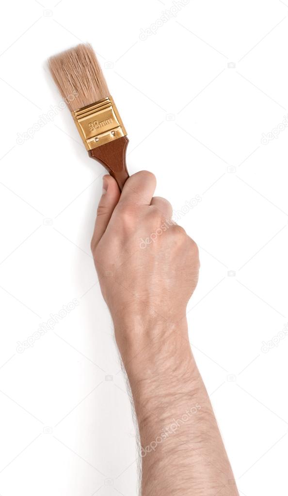 Mans hand with paint brush Stock Photo by ©gearstd 121420780