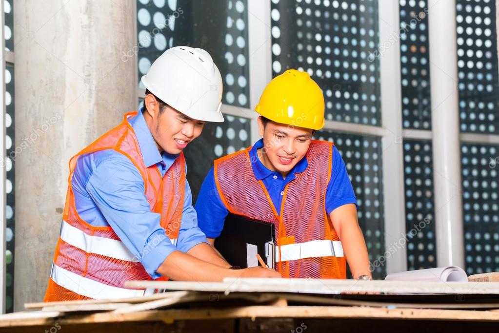 Asian architect and supervisor on building site Stock Photo by ©Kzenon ...