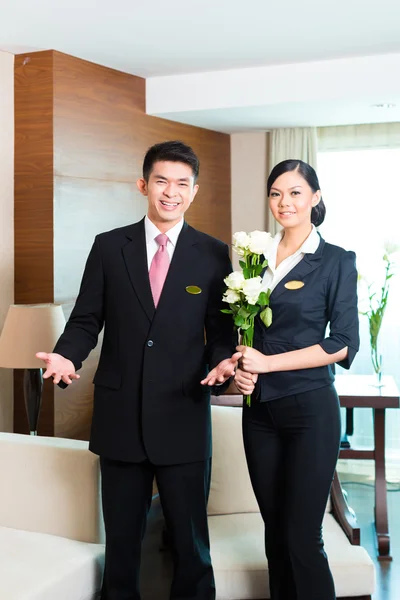 Hotel manager welcoming VIP guests - Stock Image - Everypixel