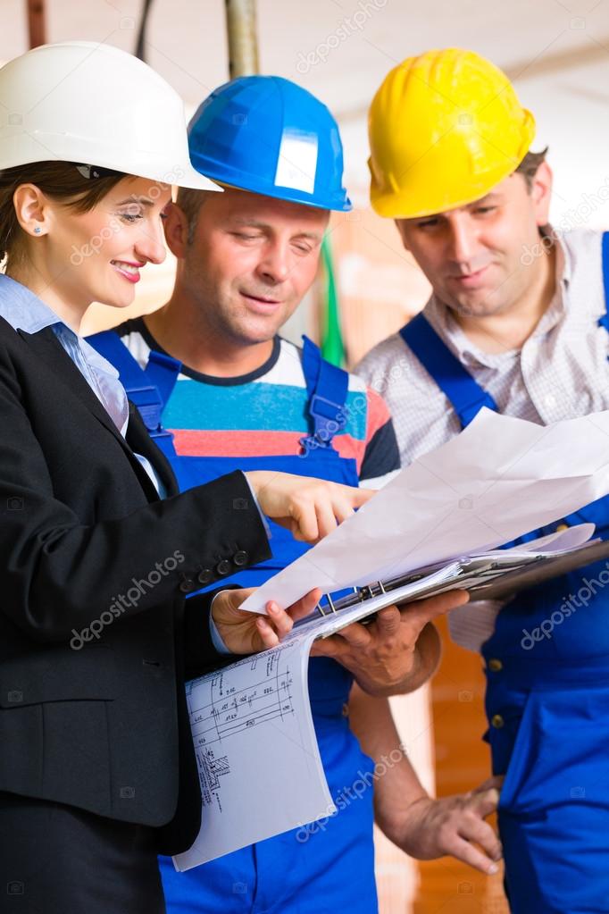 Work Team controlling floor plan Stock Photo by ©Kzenon 79330788