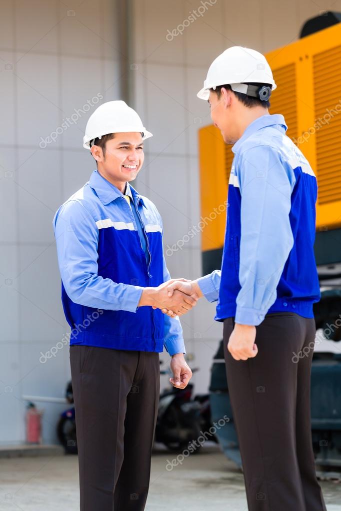 Engineers having agreement on construction site Stock Photo by ©Kzenon ...