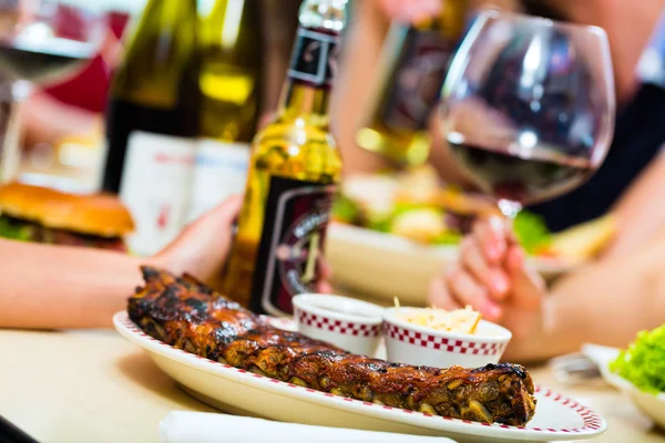 Eating ribs Stock Photos, Royalty Free Eating ribs Images | Depositphotos