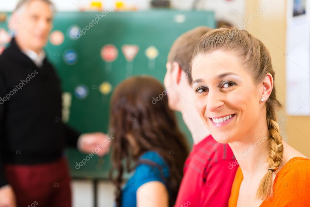 Driving instructor with his class Stock Photo by ©Kzenon 79393166