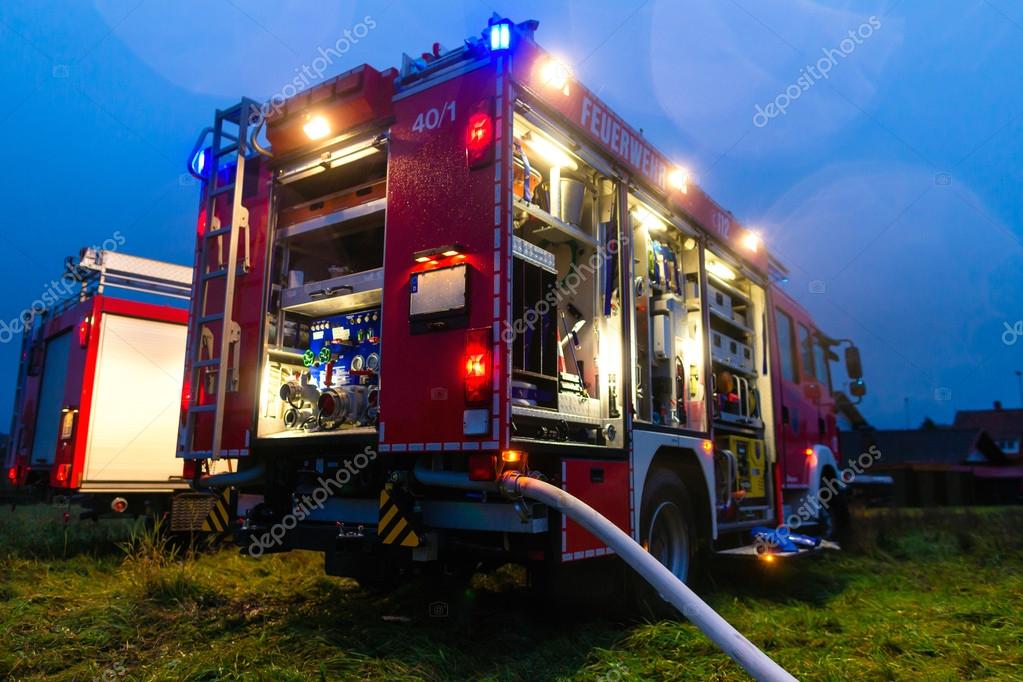 Fire truck with lights in deployment — Stock Photo © Kzenon #79651070