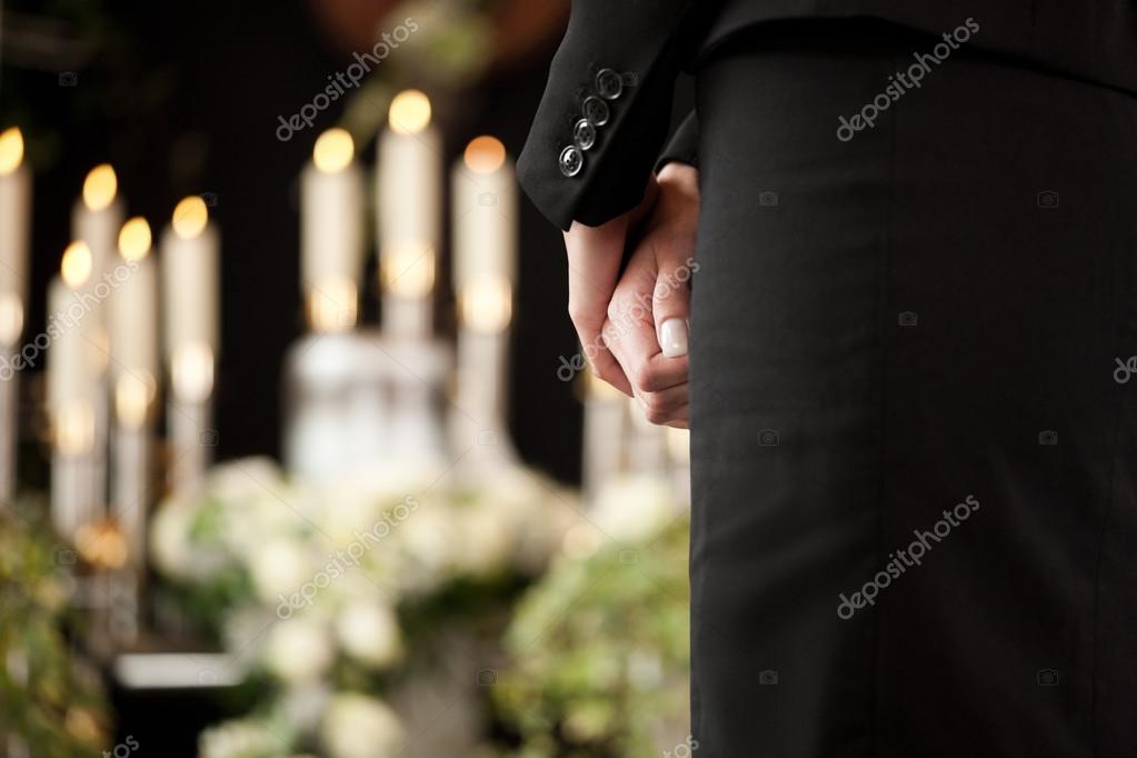 Woman at funeral mourning Stock Photo by ©Kzenon 79651900
