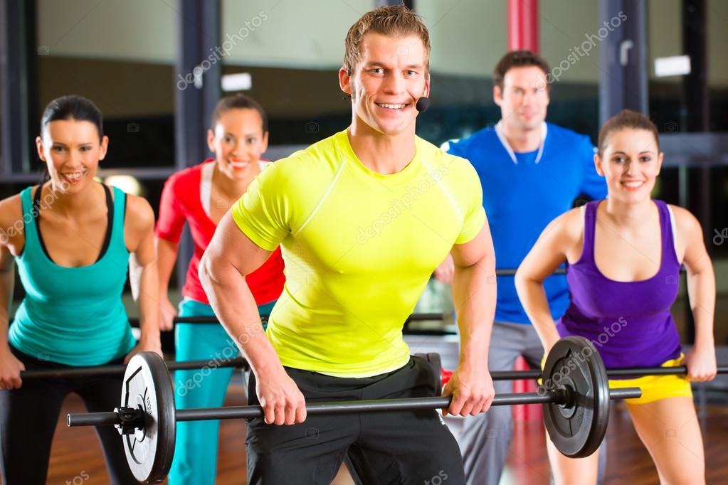 Weight training in the gym with dumbbells Stock Photo by ©Kzenon 79819676