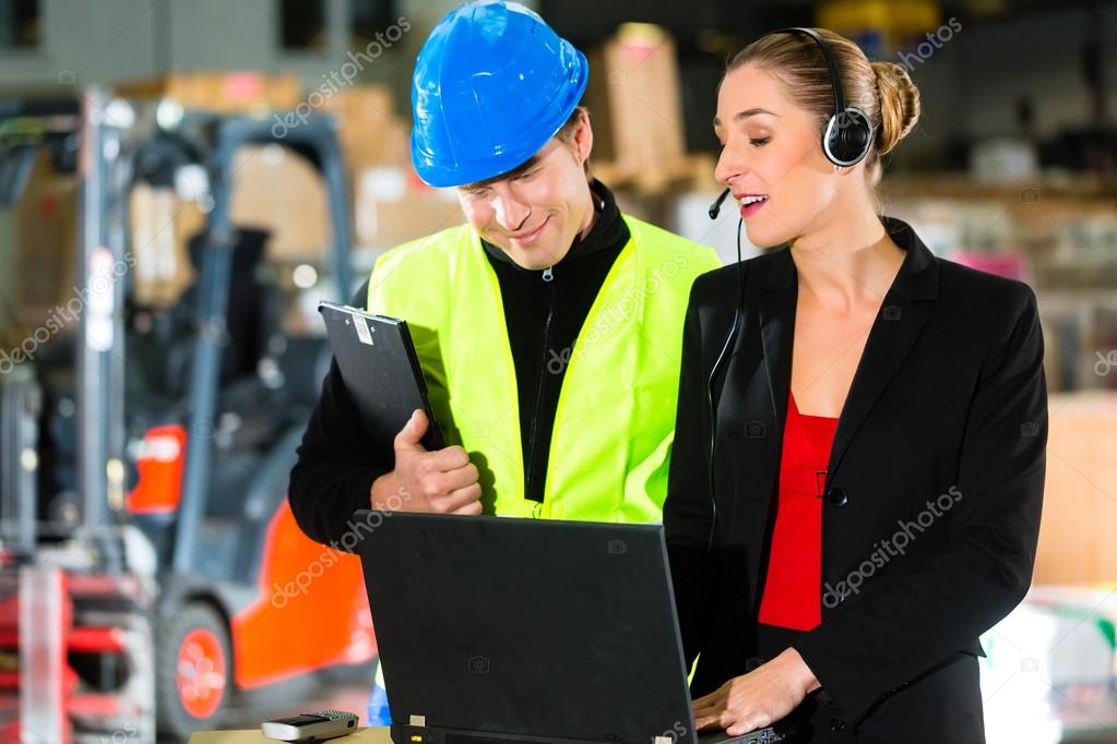 Coworkers at warehouse of forwarding company Stock Photo by ©Kzenon ...