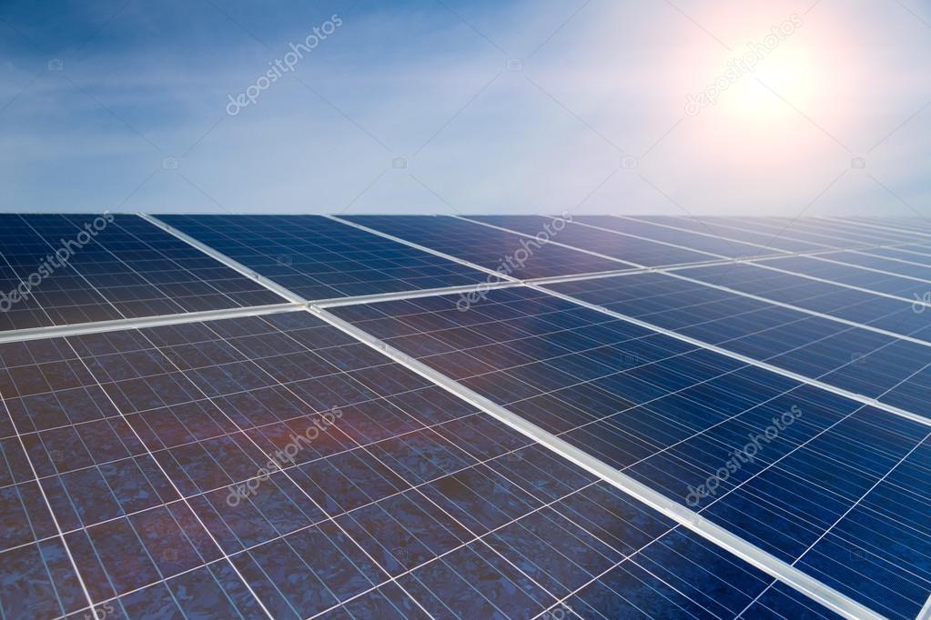 Green Energy - Solar panels with blue sky — Stock Photo © Kzenon #83008108