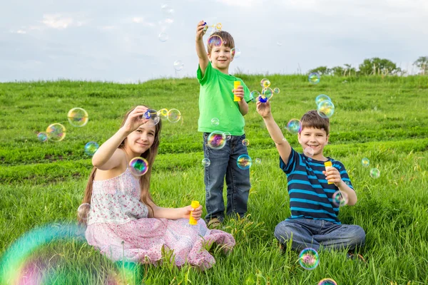 Kids blowing bubbles Stock Photos, Royalty Free Kids blowing bubbles ...