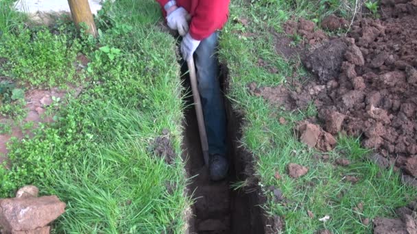 Man digging a very narrow ditch — Stock Video © alisbalb2 #108960022