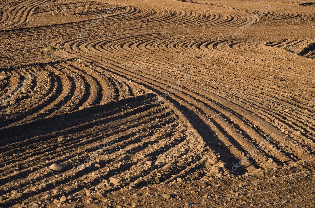 Ploughed cultivated farm field soil background Stock Photo by ...